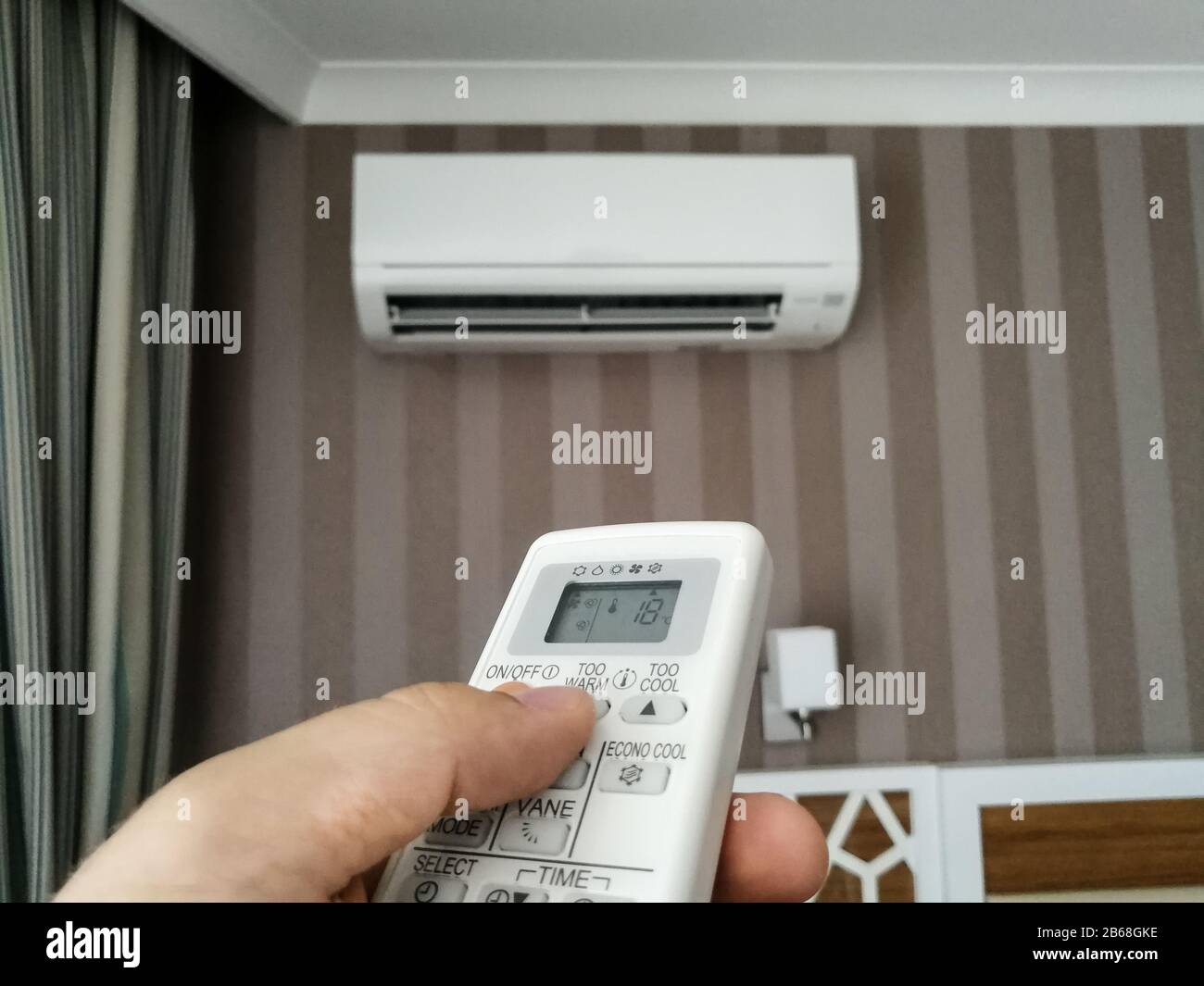Remote control setting temperature for air conditioner on the wall ...