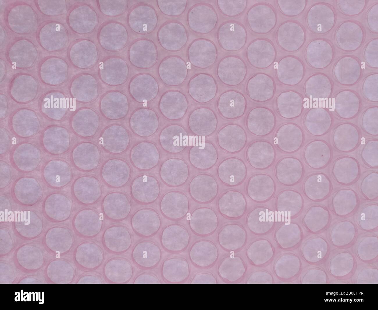 Pink bubble wrap close up for packing fragile things Stock Photo - Alamy