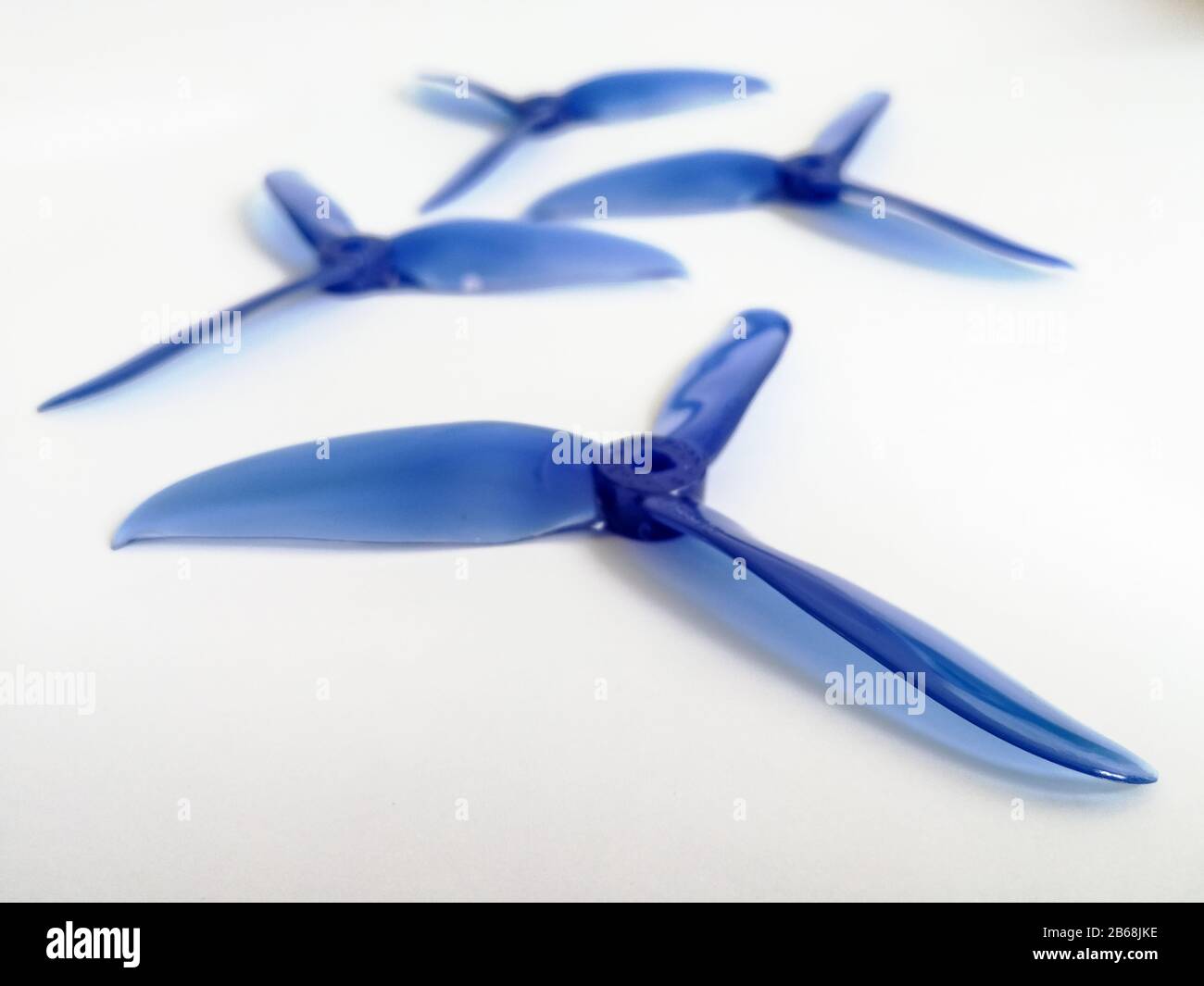 Plastic blue racing drone propeller on the white background Stock Photo ...