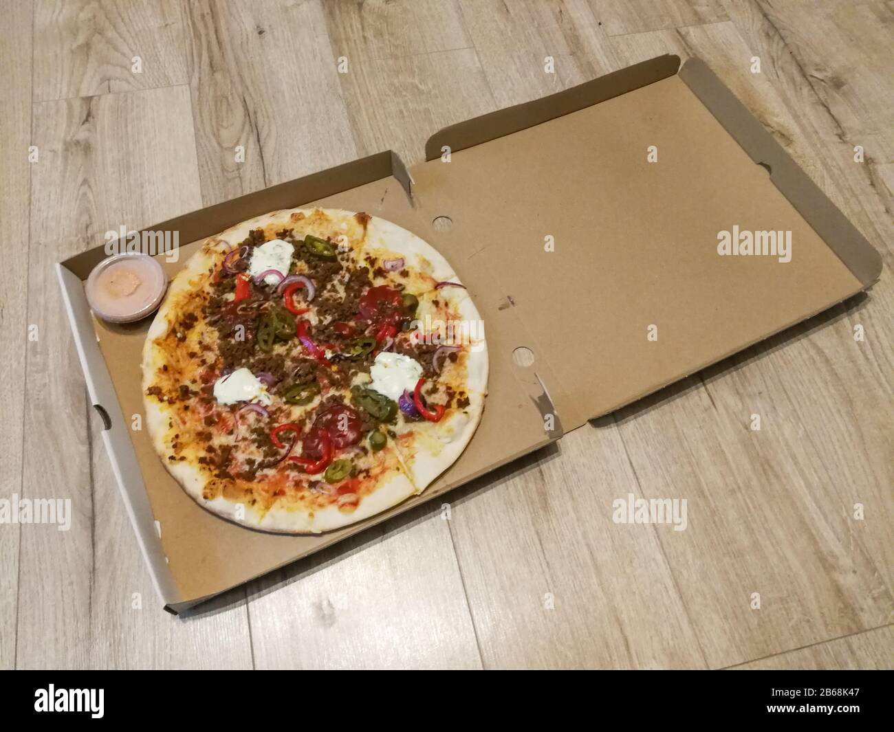 Hot spicy pizza with mint in the take away cardboard box Stock Photo ...