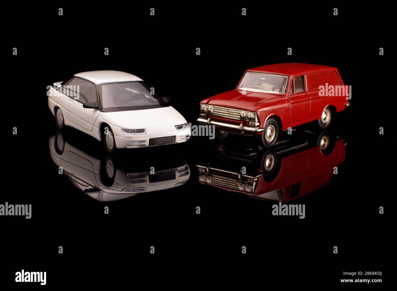 Vintage soviet die cast plastic and metal model cars on the dark ...