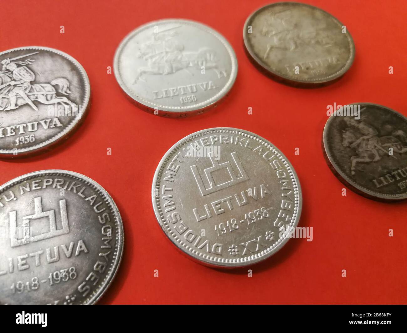 Group of 6 lithuanian Litai coins on the red background Stock Photo - Alamy