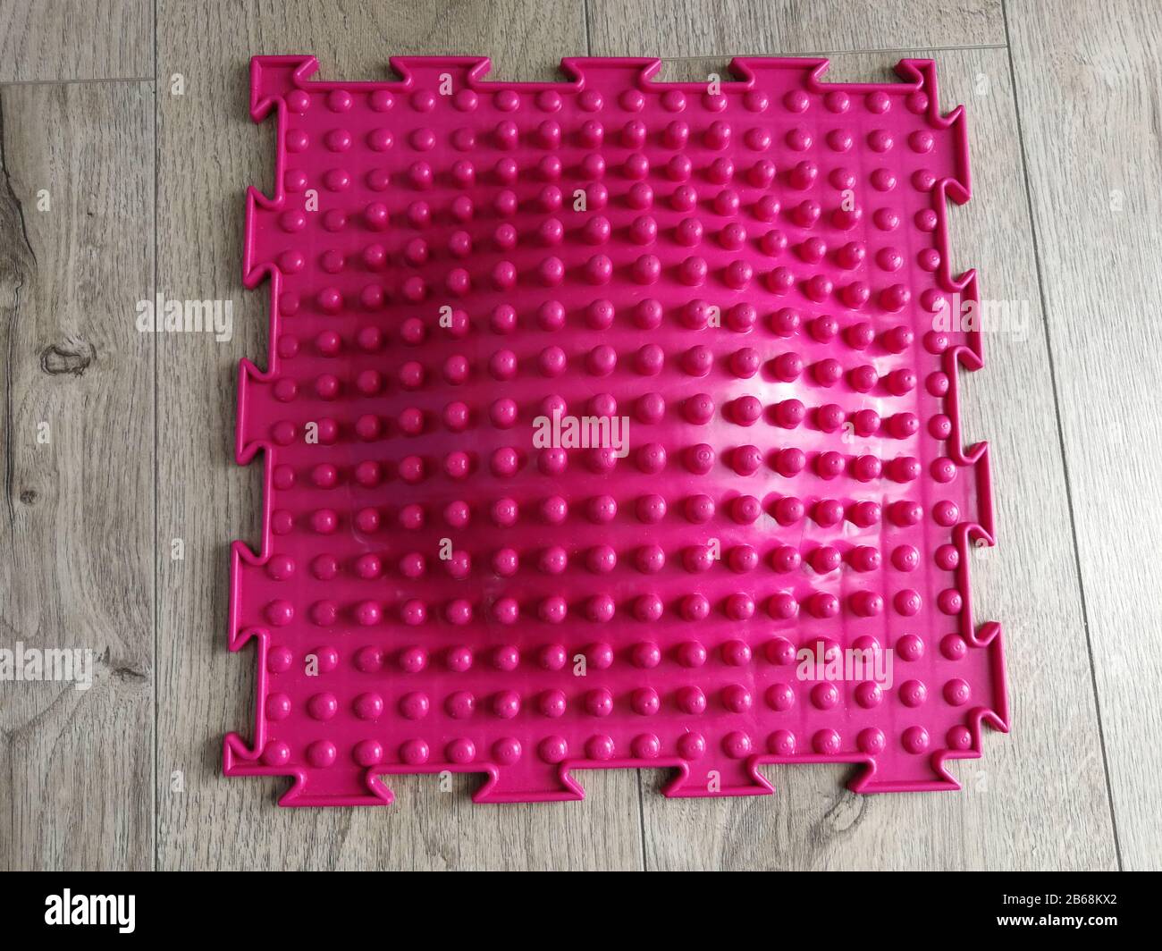 Orthopedic medical massage carpet for feet therapy Stock Photo - Alamy