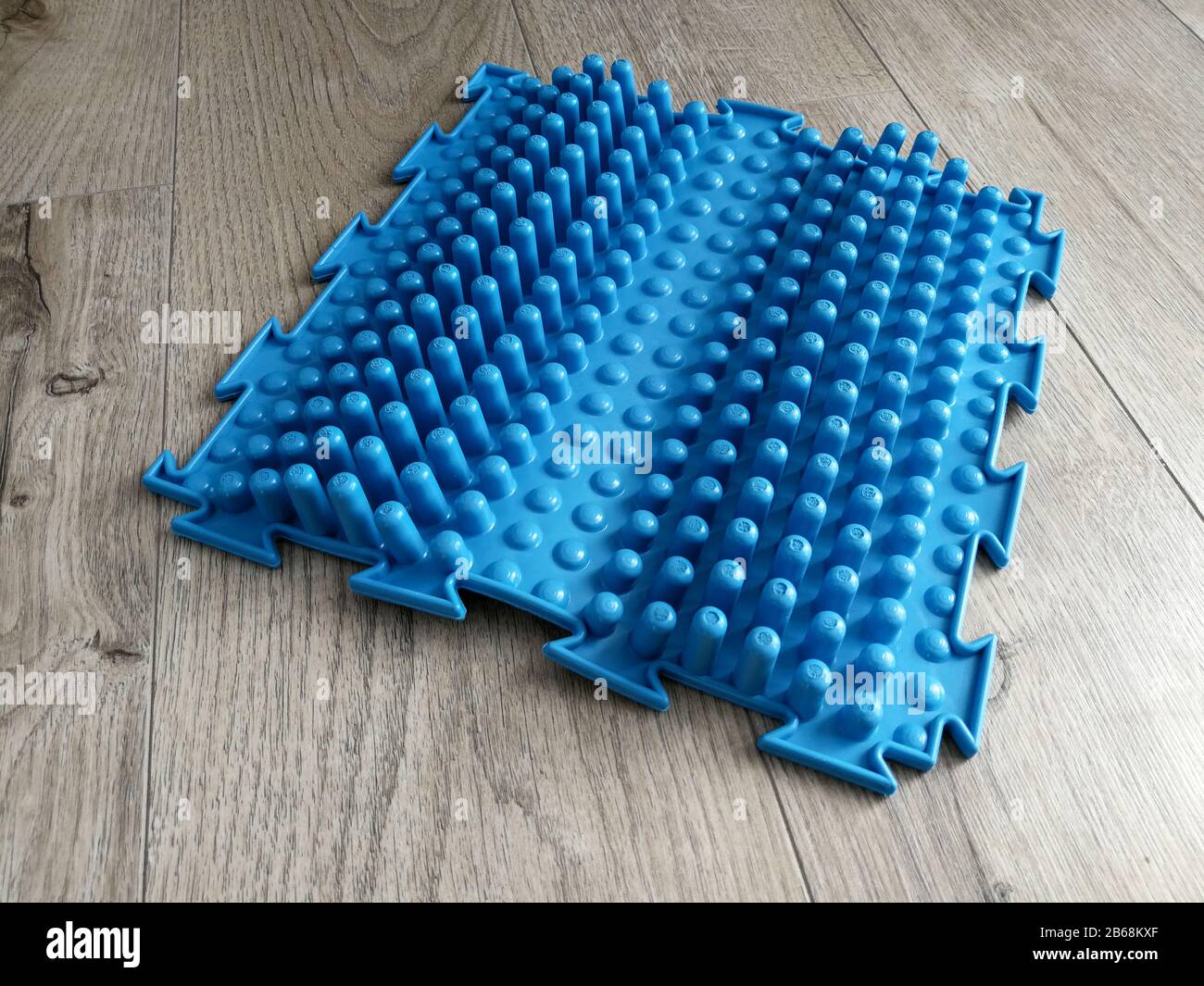 Orthopedic medical massage carpet for feet therapy Stock Photo - Alamy