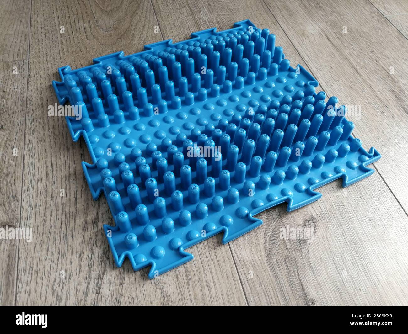 Orthopedic medical massage carpet for feet therapy Stock Photo - Alamy