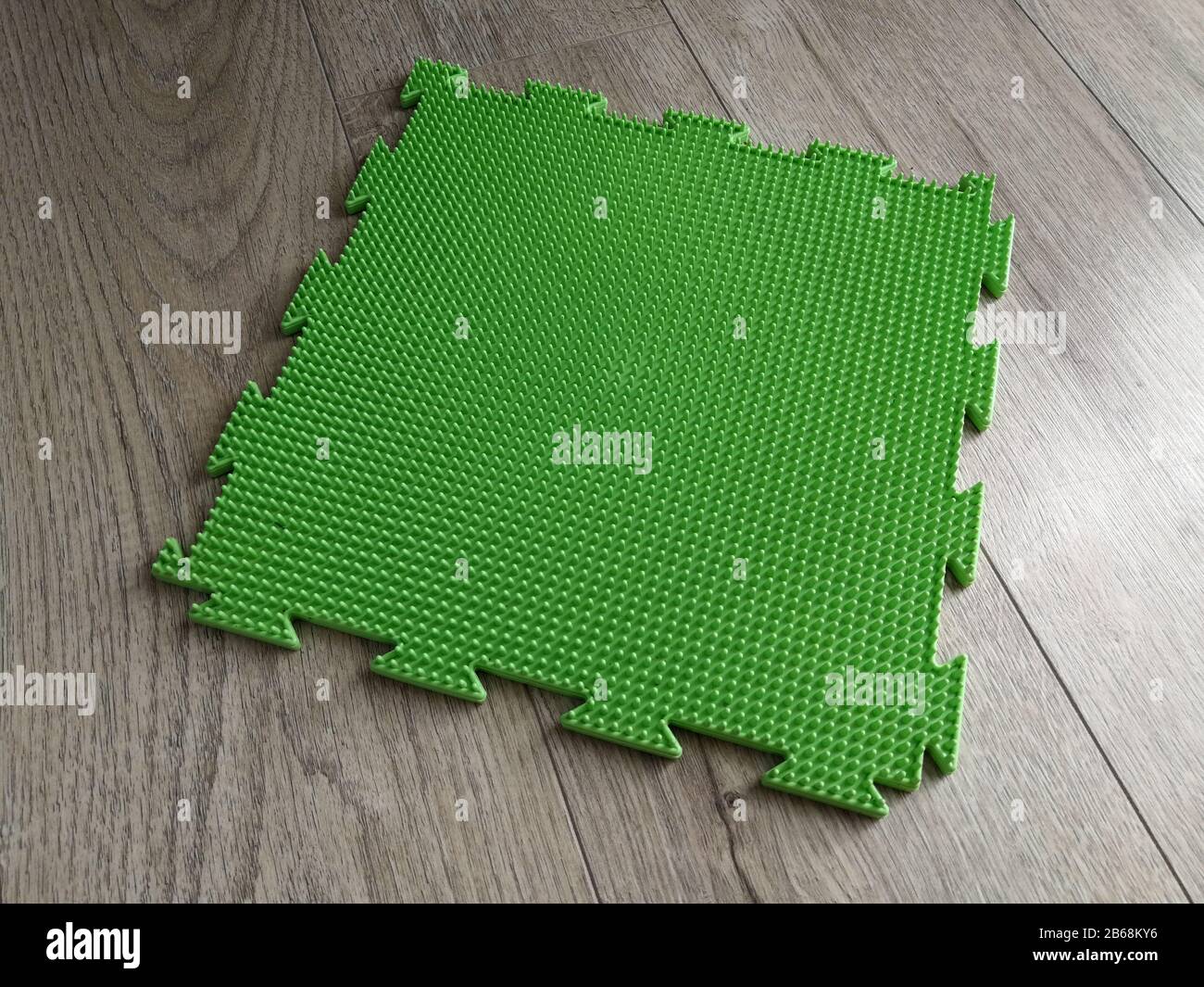 Orthopedic medical massage carpet for feet therapy Stock Photo - Alamy