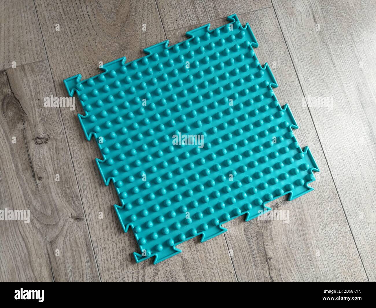 Orthopedic medical massage carpet for feet therapy Stock Photo - Alamy