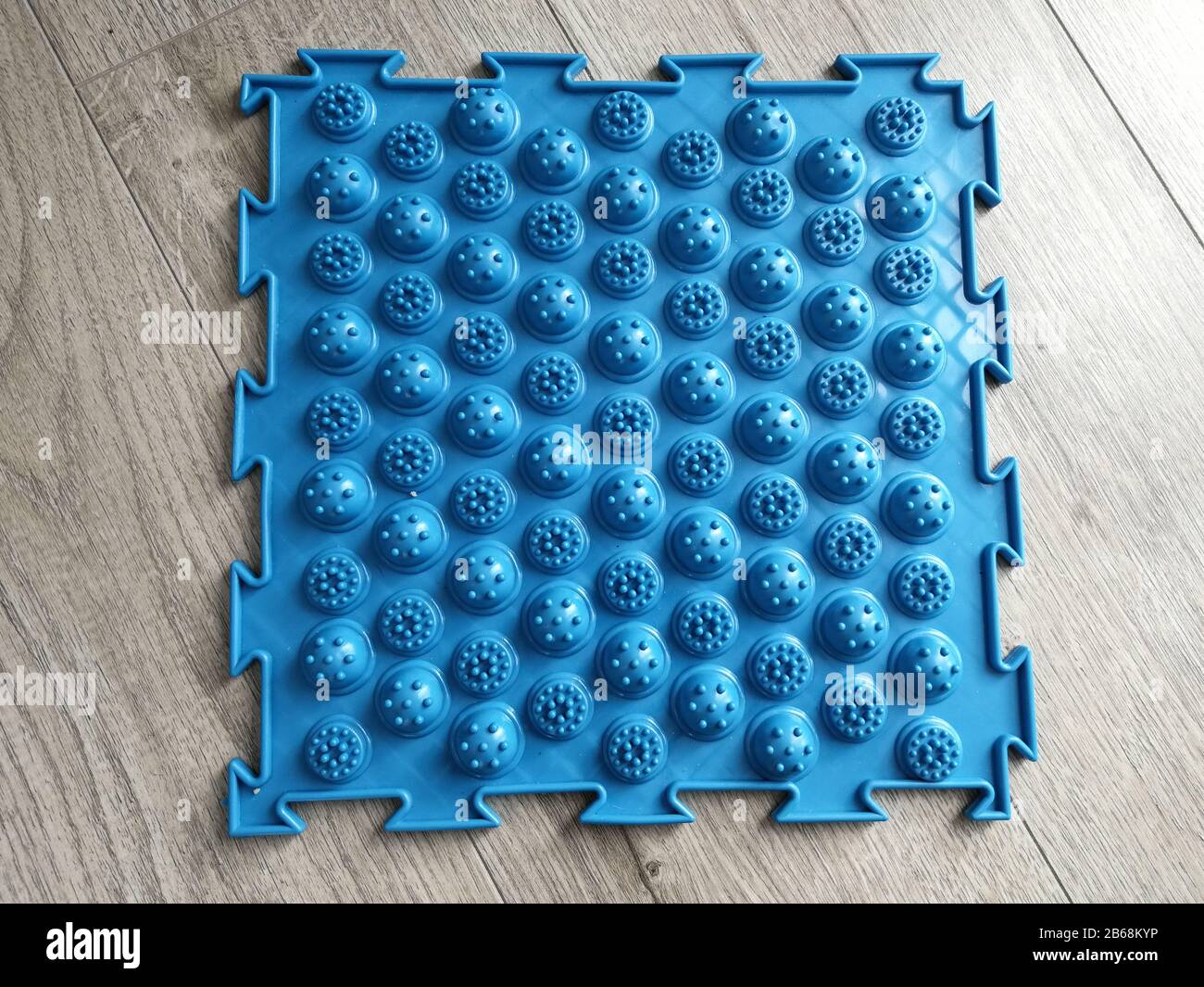 Orthopedic medical massage carpet for feet therapy Stock Photo - Alamy