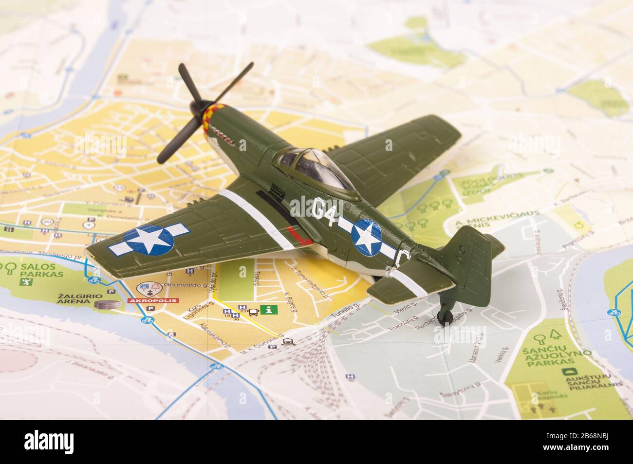 Old World War II model plane placed on the city map Stock Photo - Alamy