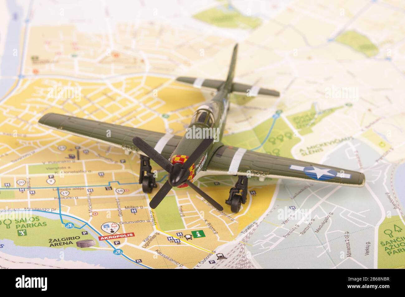 Old World War II model plane placed on the city map Stock Photo - Alamy