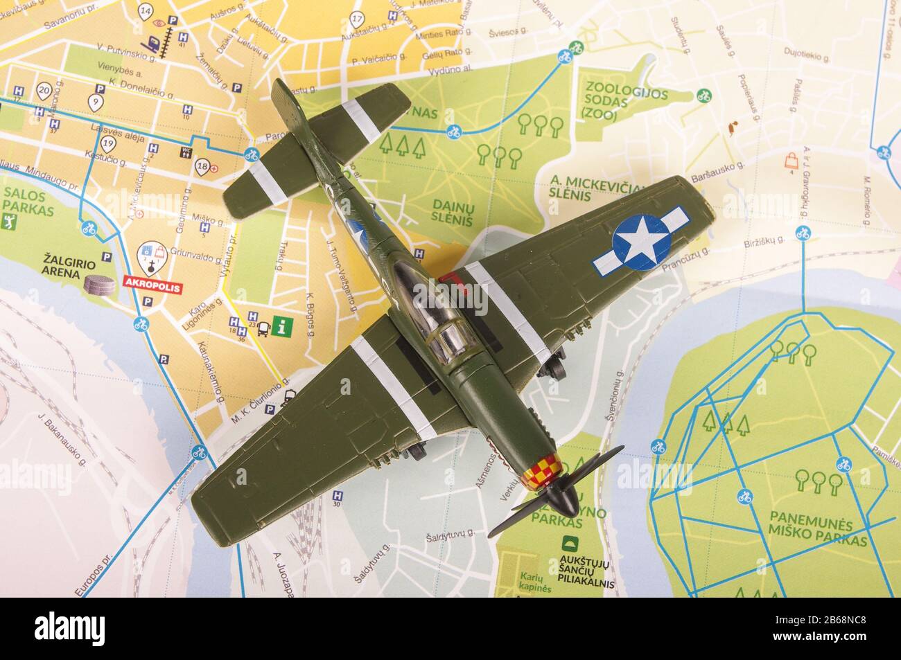 Old World War II model plane placed on the city map Stock Photo - Alamy