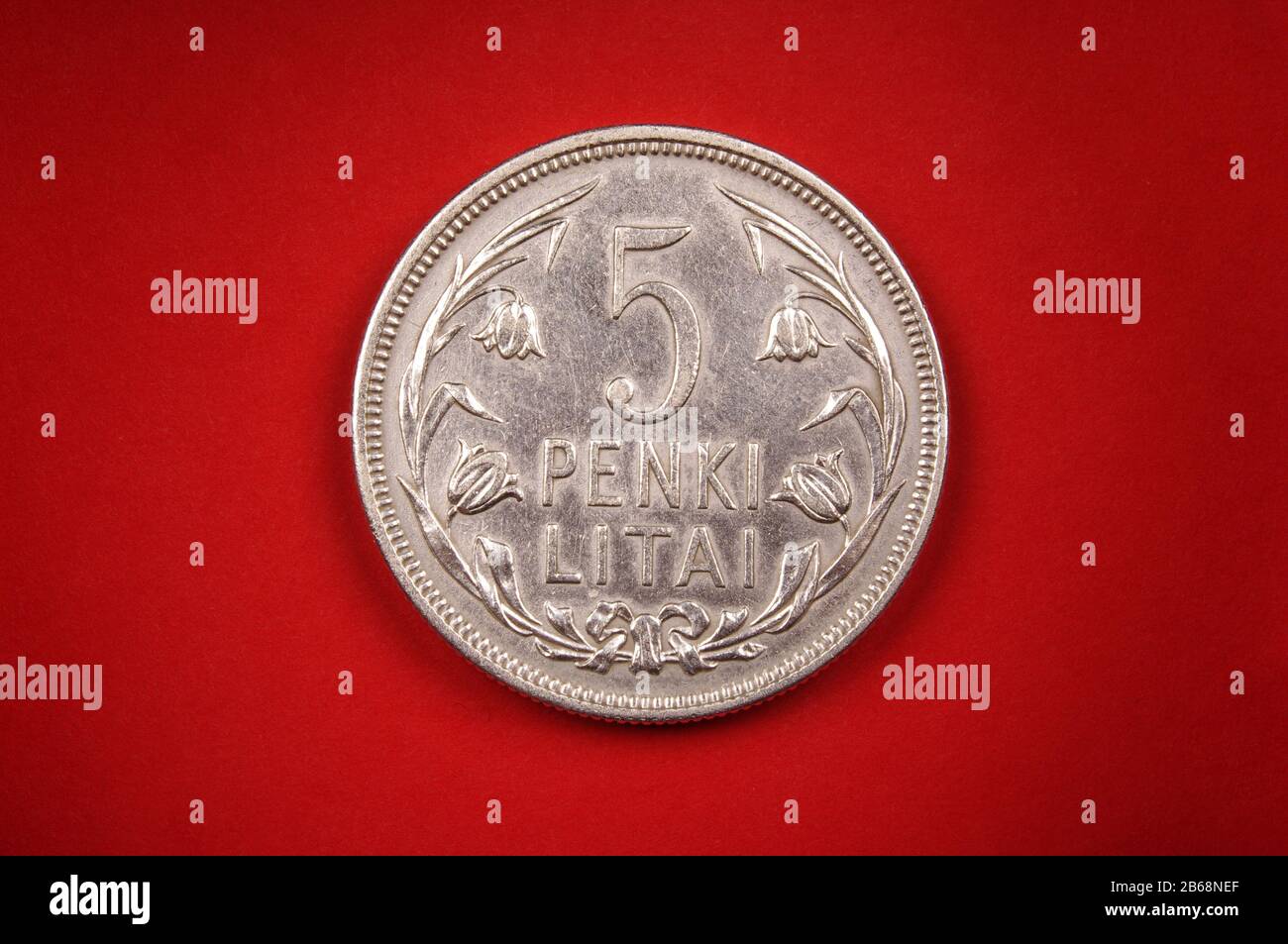 1925 year Lithuanian 5 Litas silver coin isolated on the red background ...