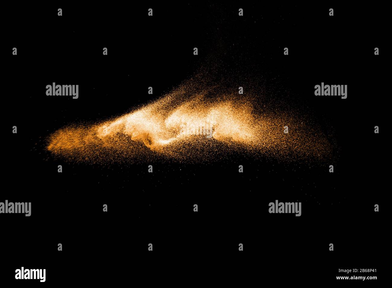 Brown colored sand splash.Dry river sand explosion isolated on black ...