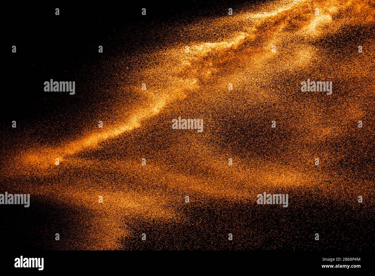 Brown colored sand splash.Dry river sand explosion isolated on black ...