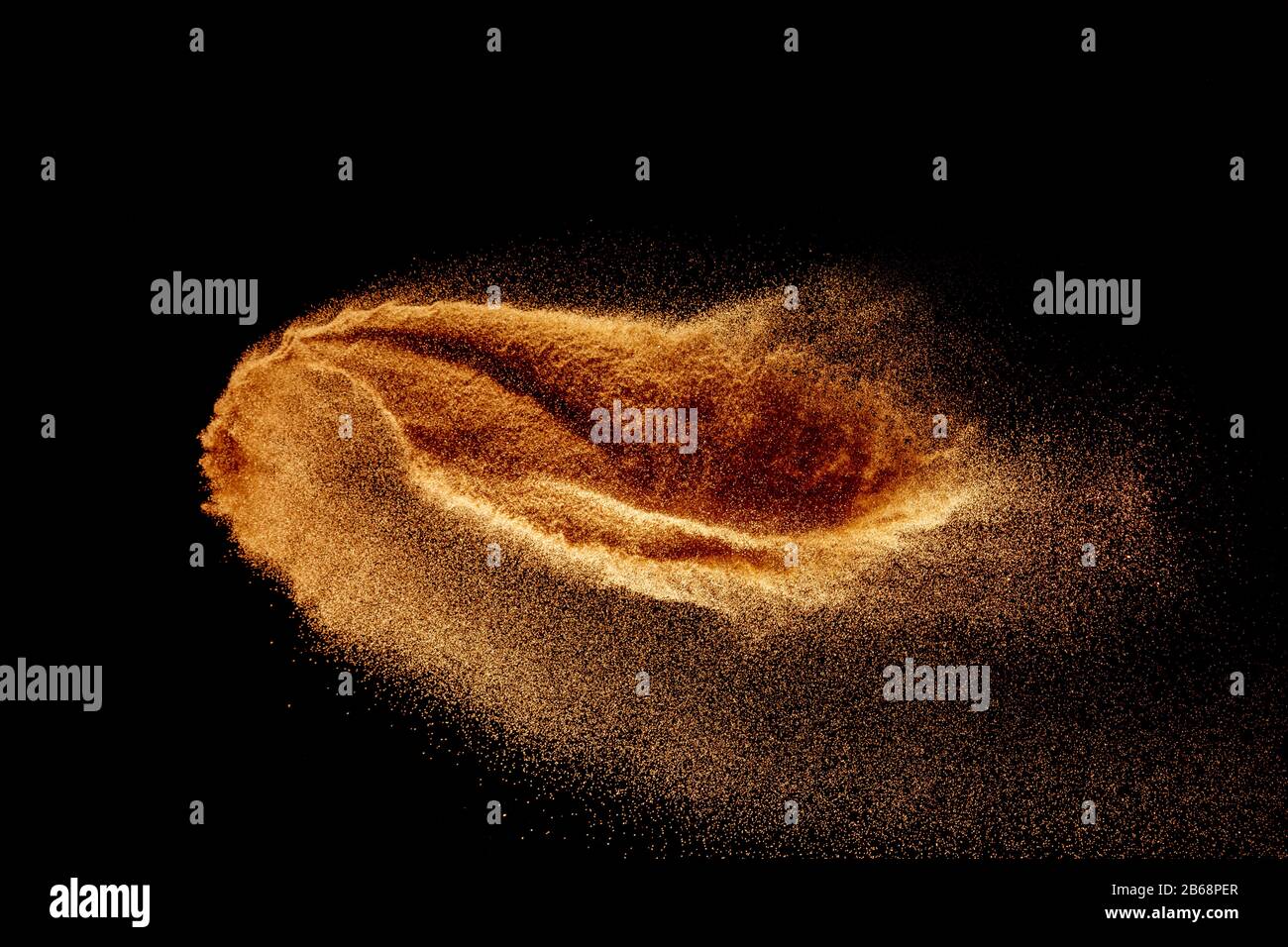 Brown colored sand splash.Dry river sand explosion isolated on black ...