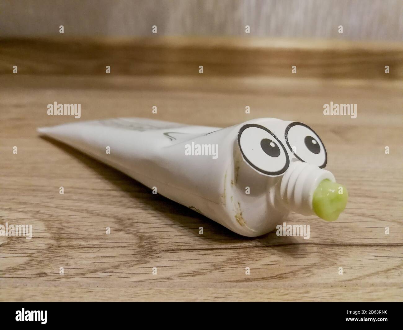 Dirty toothpaste tuber sticked eyes. Crazy ideas concept Stock Photo ...