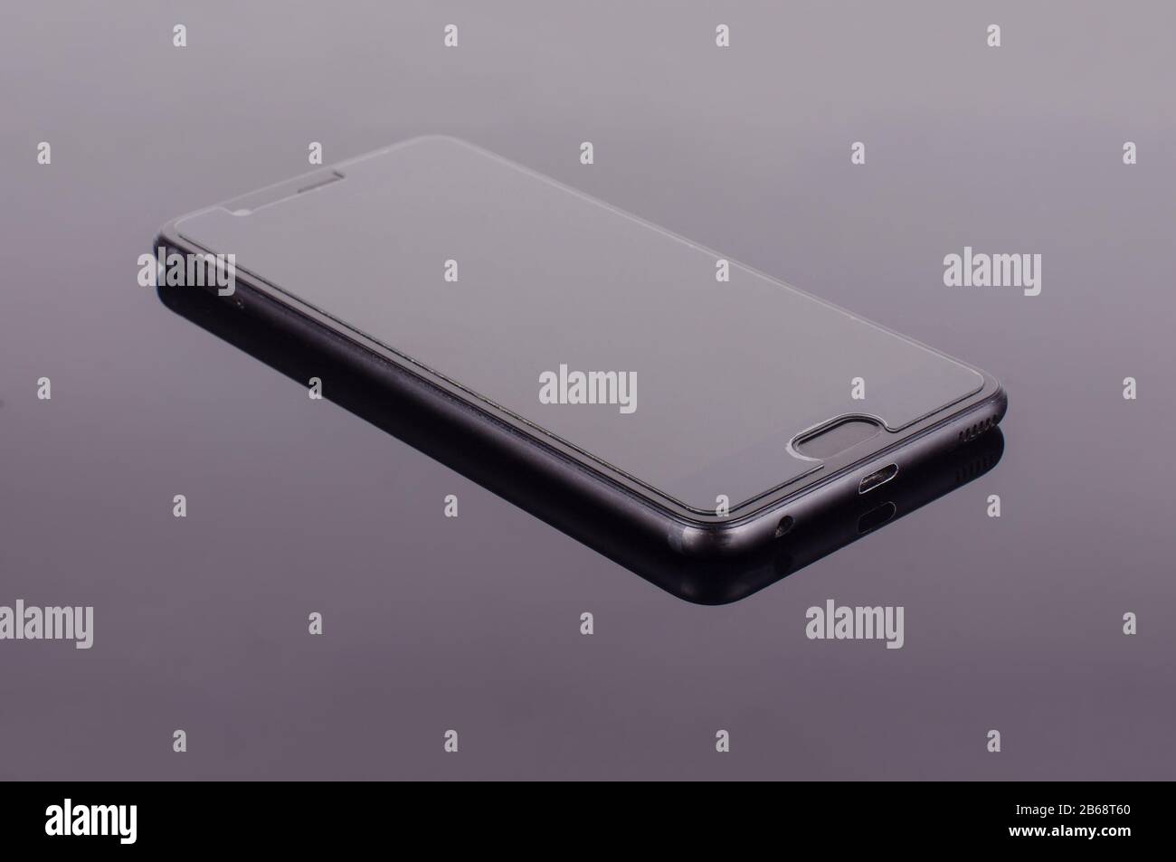 Smartphone or cell phone with big screen isolated on the dark ...