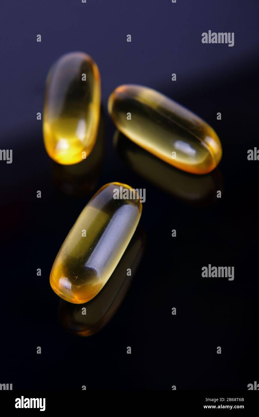 Macro close up of Omega 3 vitamin fatty acids capsules for healthy ...