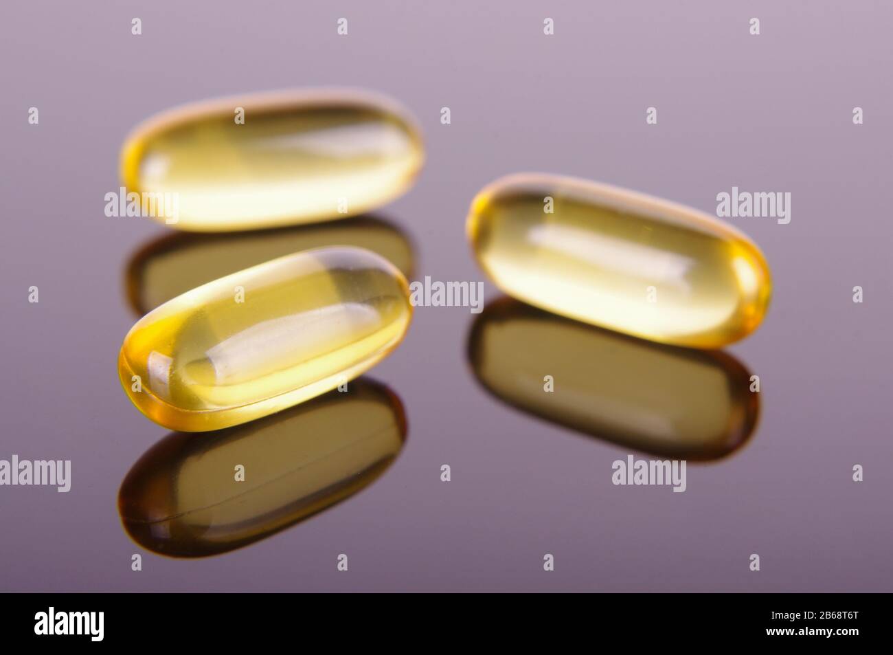 Macro close up of Omega 3 vitamin fatty acids capsules for healthy ...