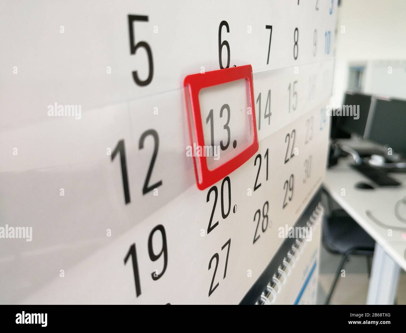 13th day marked with red marker on the office wall calendar Stock Photo ...