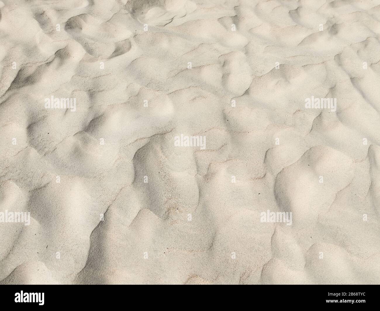 Natural sandy beach sand surface texture shaped by wind Stock Photo - Alamy