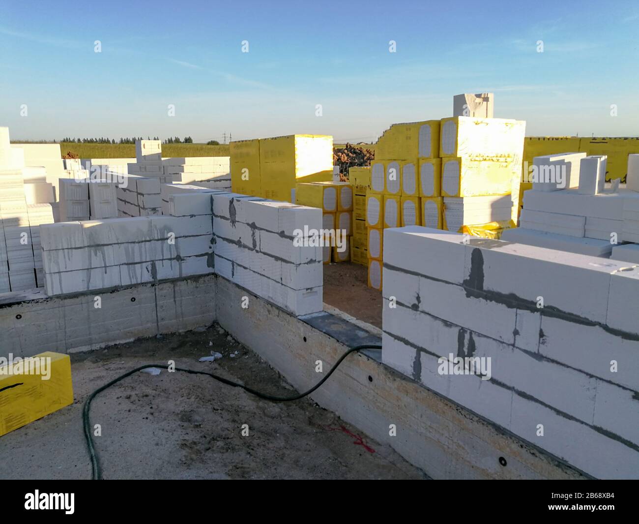 First stages of building a house. Half build from silicate blocks Stock ...