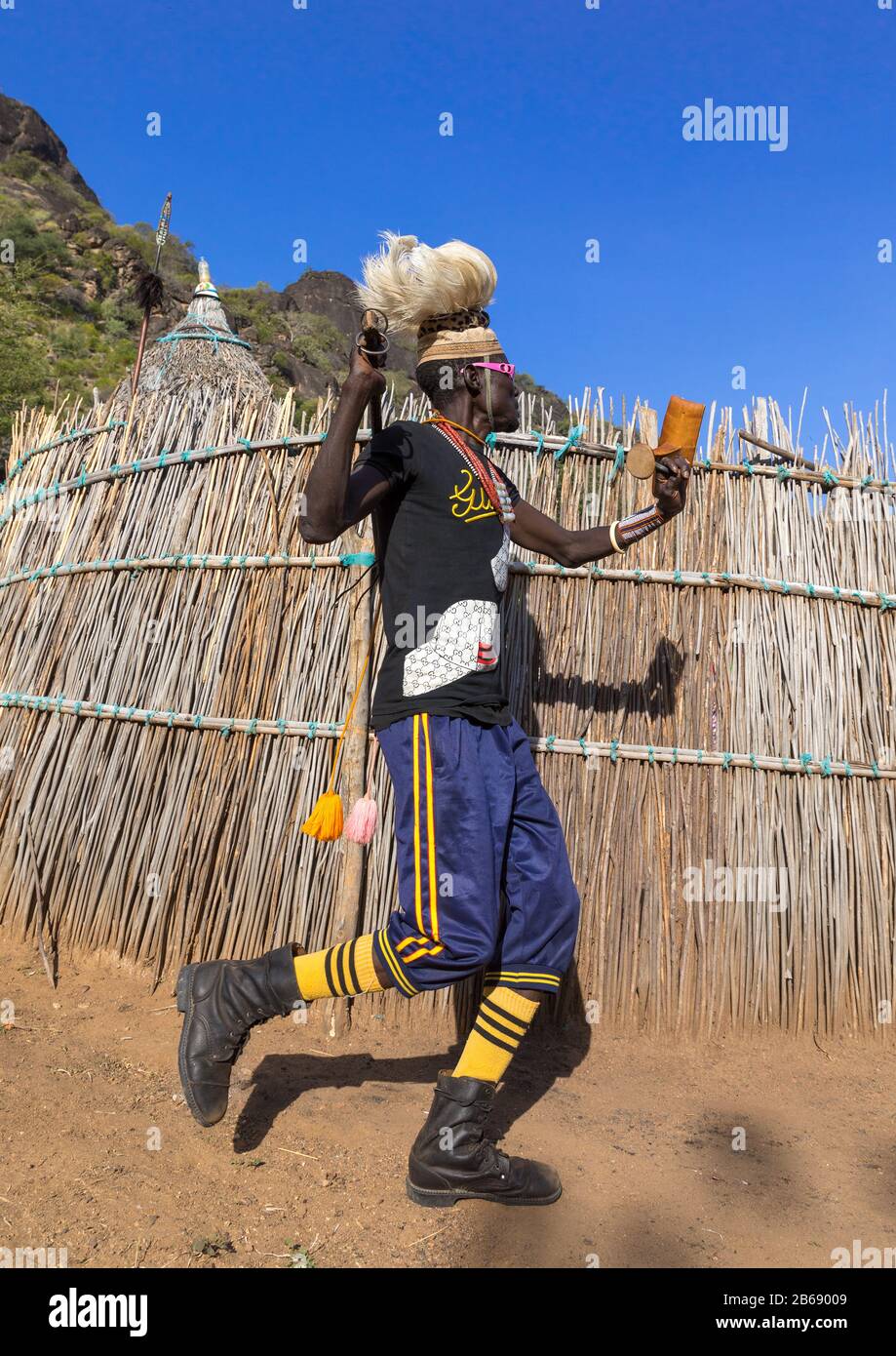 Larim tribe man dancing during a wedding ceremony, Boya Mountains ...
