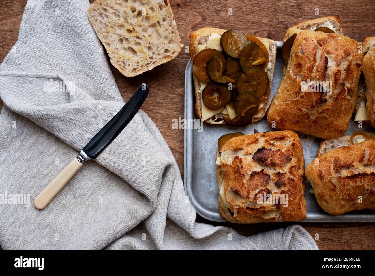High angle close up of freshly baked bread rolls in an artisan bakery ...