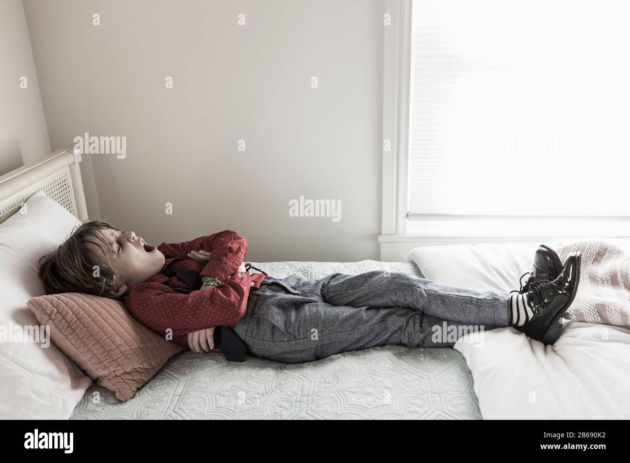 6 year old boy resting on his bed Stock Photo - Alamy