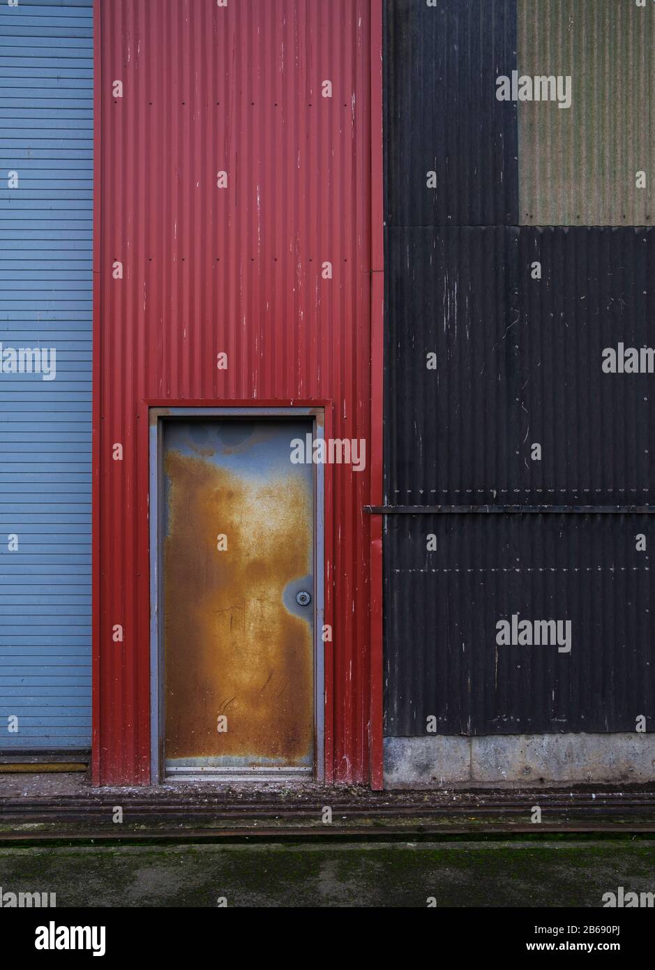 Colorfully painted warehouse exterior, doorway and loading area ...