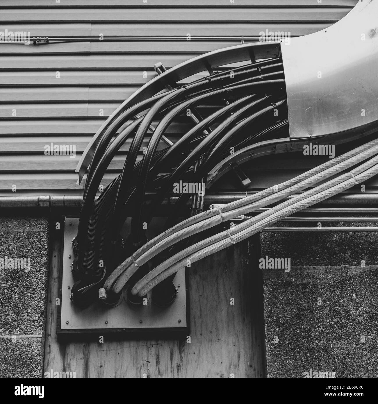 Electrical wiring on building exterior Stock Photo - Alamy