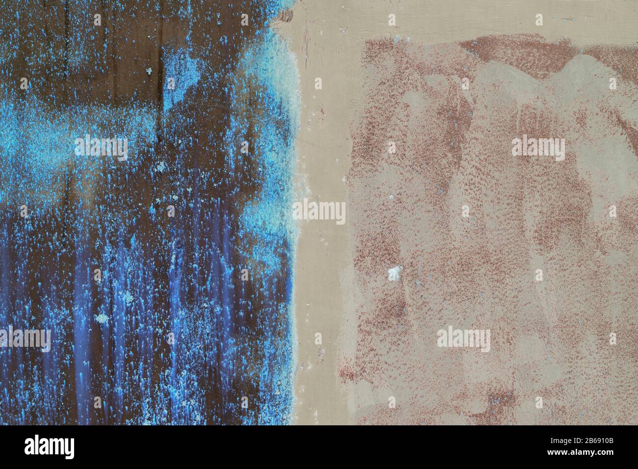 Inverted abstract image of rusty metal wall, half covered in paint ...