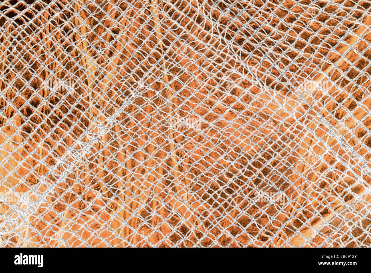 Detail of commercial fish net covering tarpaulin Stock Photo - Alamy