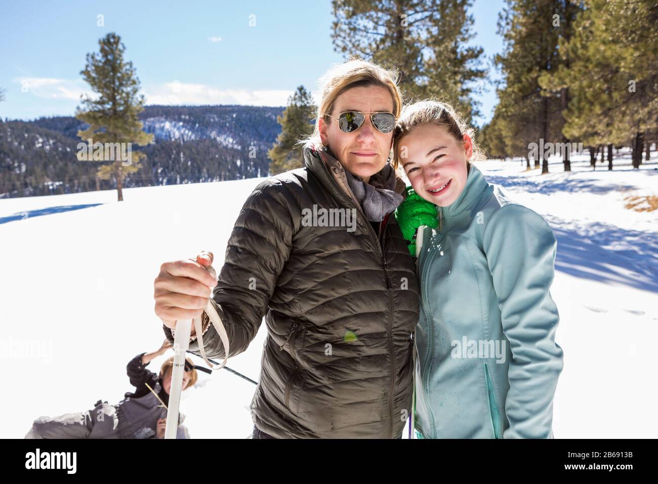 Portrait of mother and her thirteen year old daughter out in the snow Stock Photo - Alamy