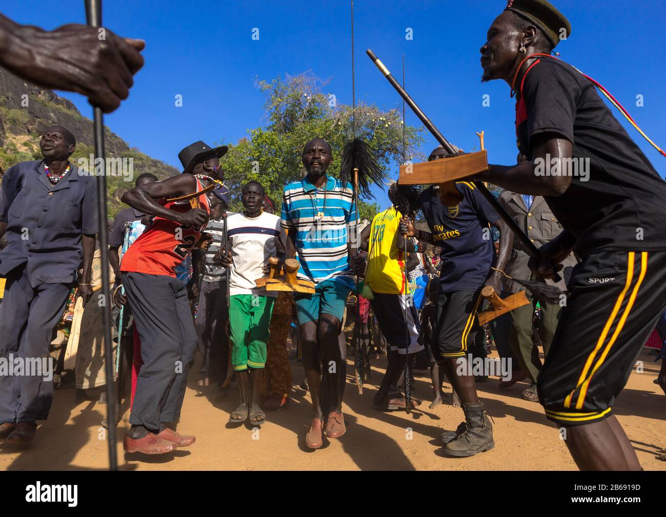 Larim tribe men dancing during a wedding ceremony, Boya Mountains ...