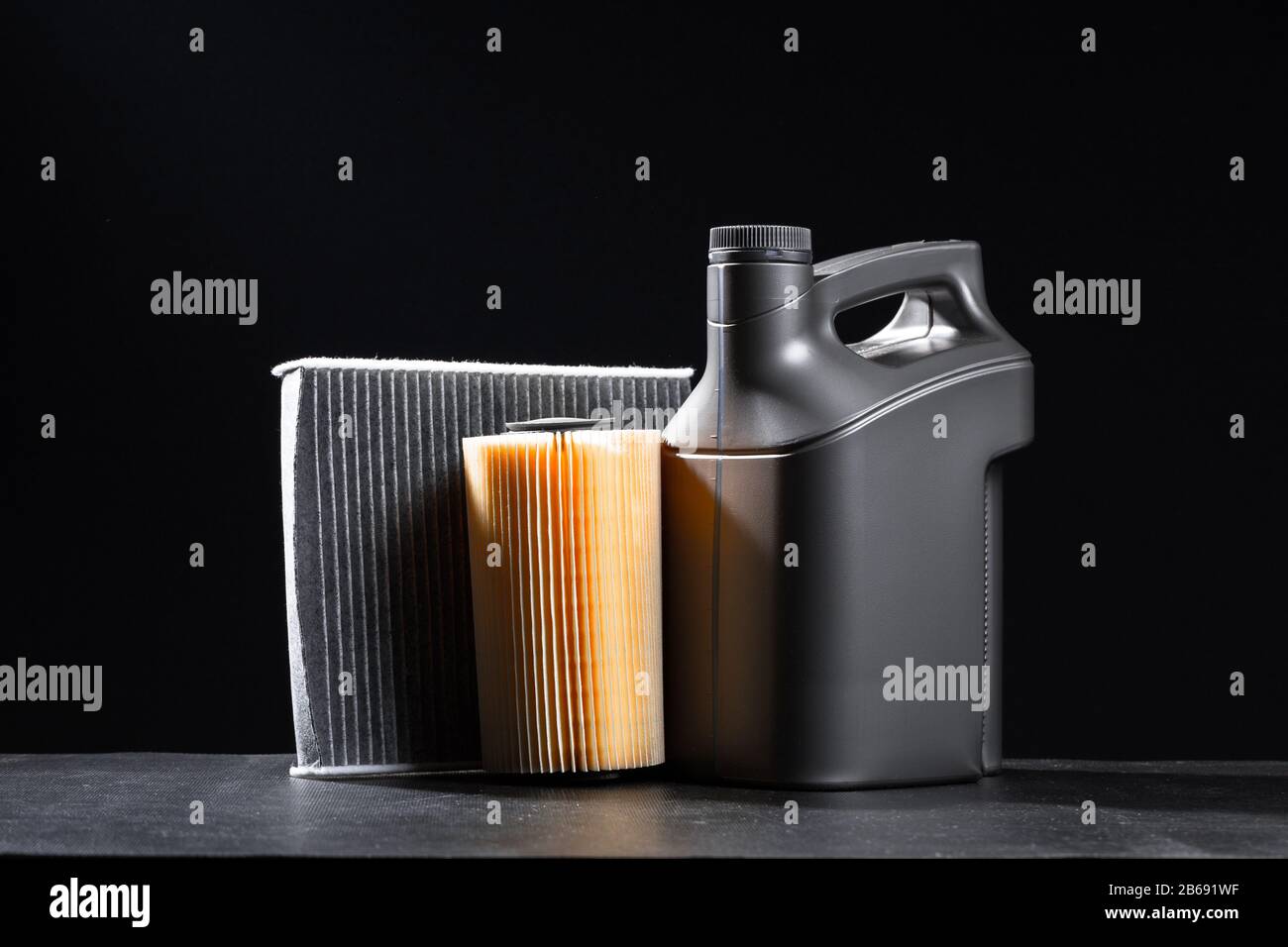 New car parts on a dark background Stock Photo - Alamy