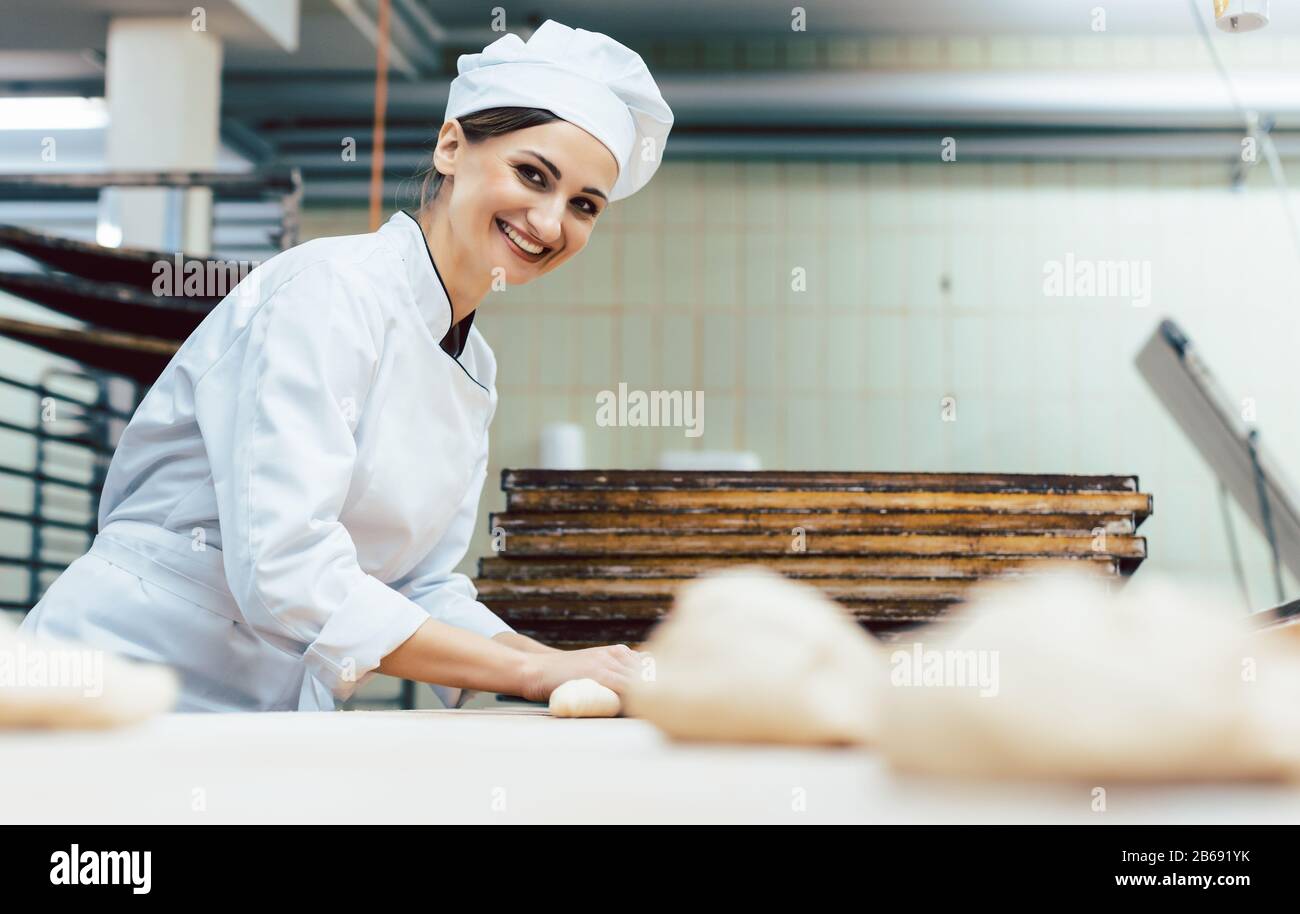Female baker making bread hi-res stock photography and images - Alamy