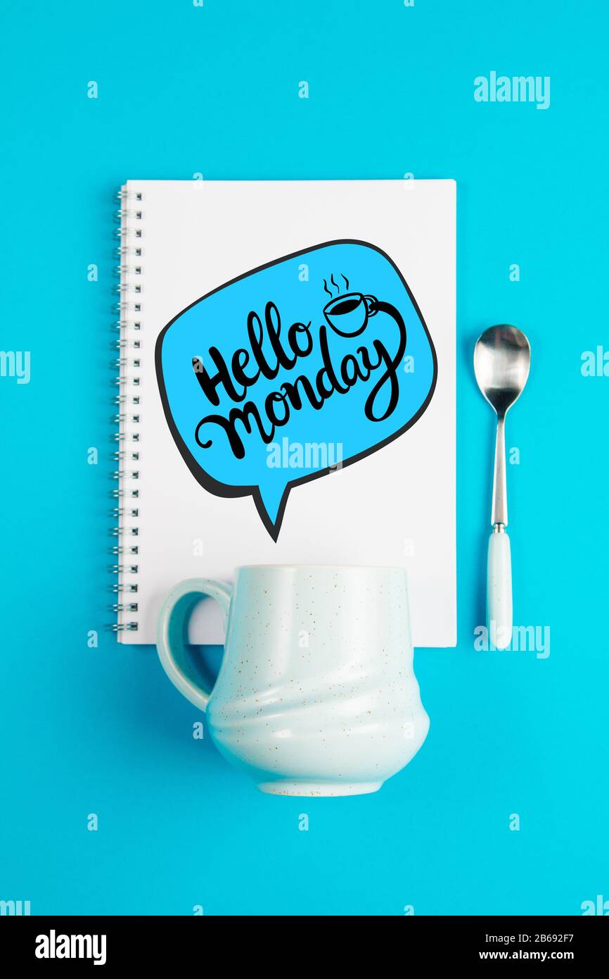 Blue coffee mug on a blue background with the text Hello Monday Stock ...