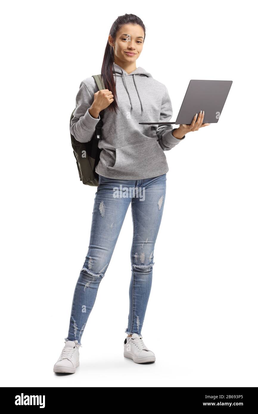 Full length portrait of a female student with backpack holding a laptop ...