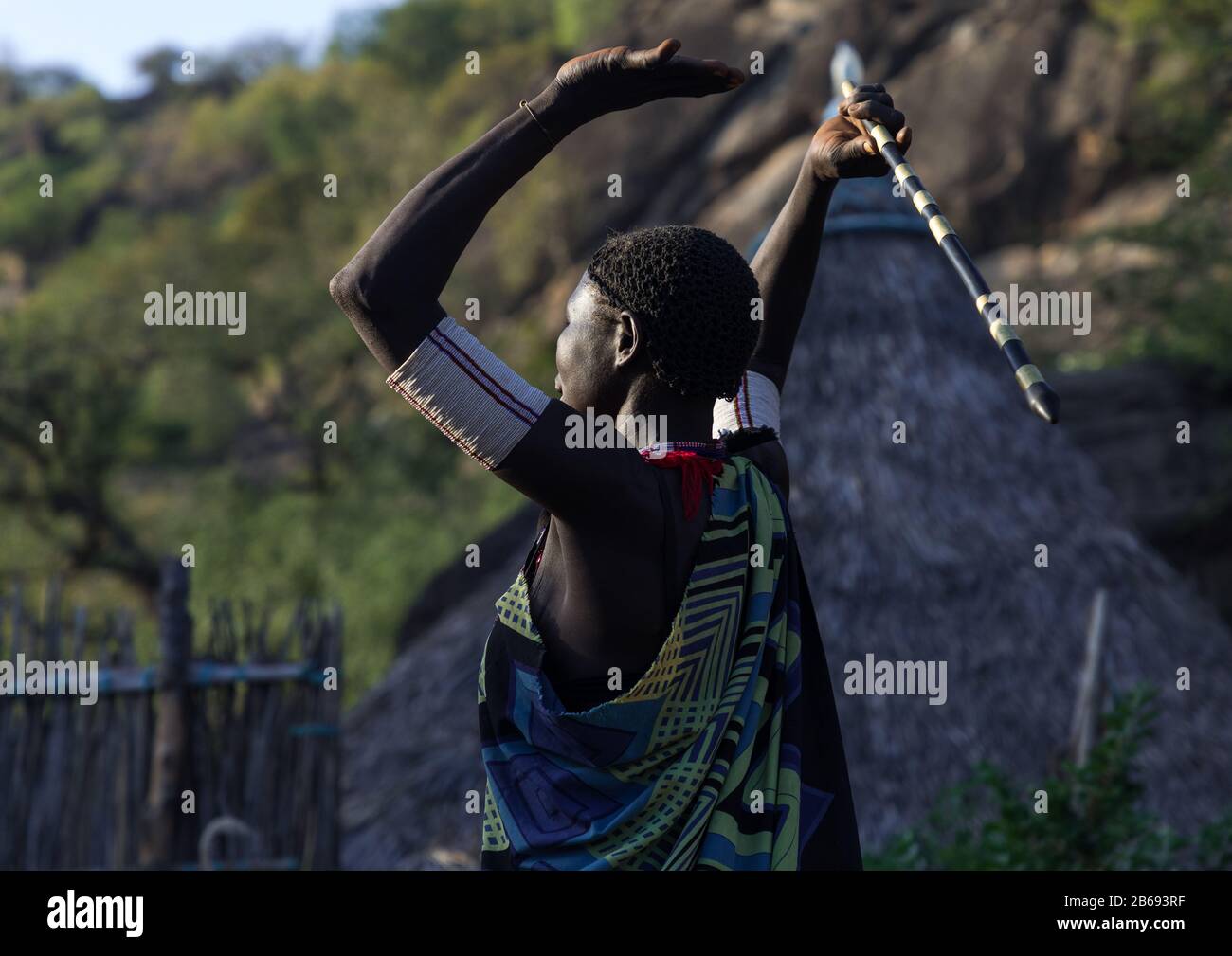 Larim tribe woman dancing during a wedding celebration, Boya Mountains ...