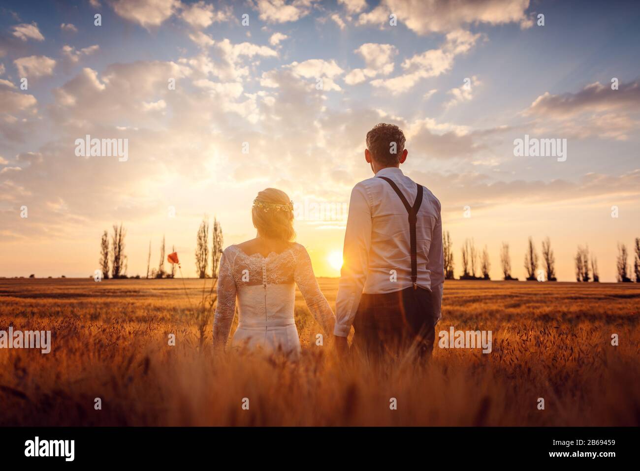 Woman beautiful romantic sunset flowers hi-res stock photography and ...