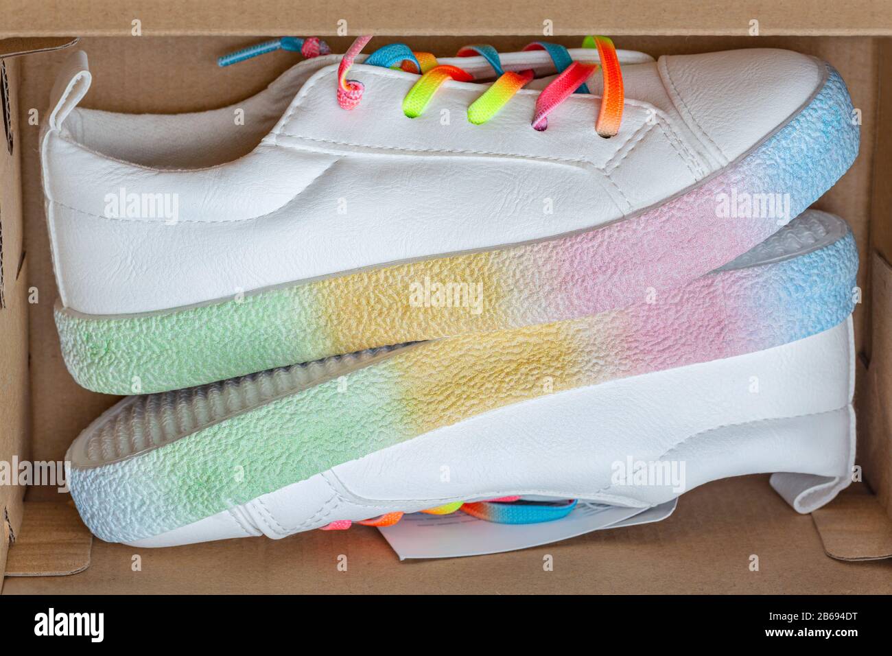 white sneakers with rainbow shoelaces are in a brown box Stock Photo ...
