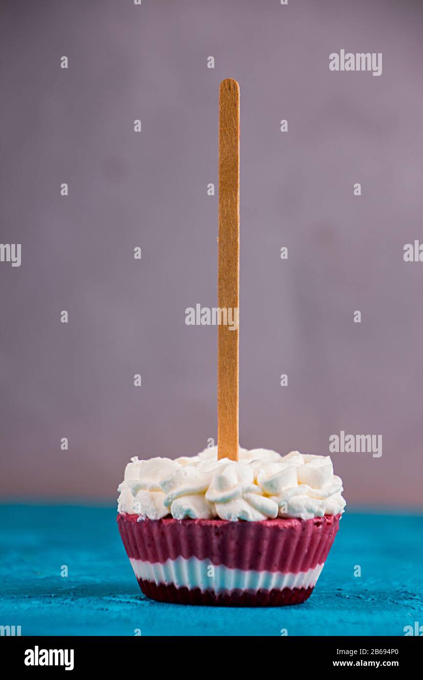 Strawberry ice cream popsicle lollies with whipped cream frozen in ...