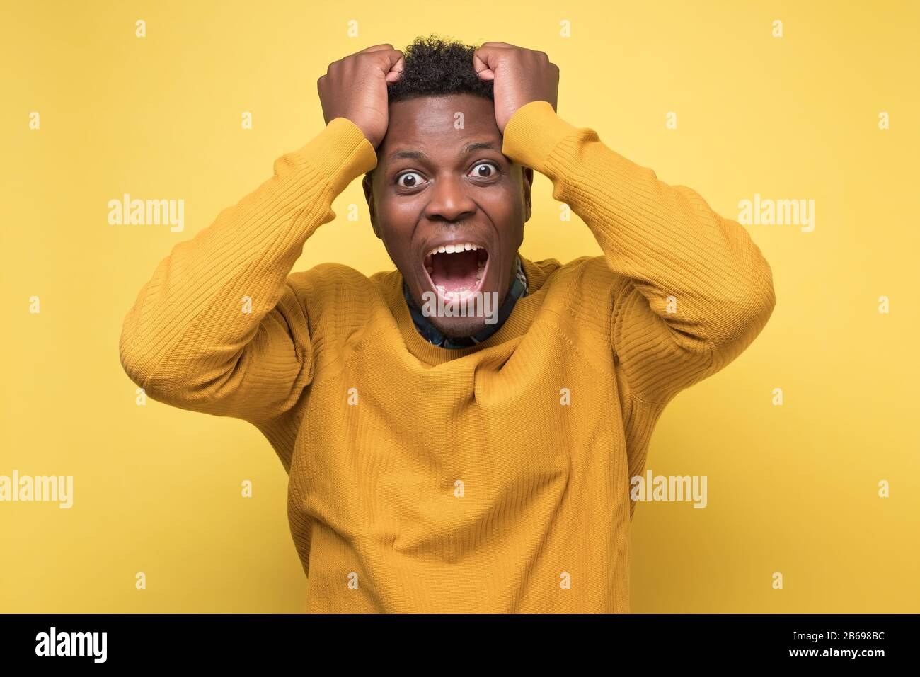 Human face expressions and emotions. African male screaming in surprise ...