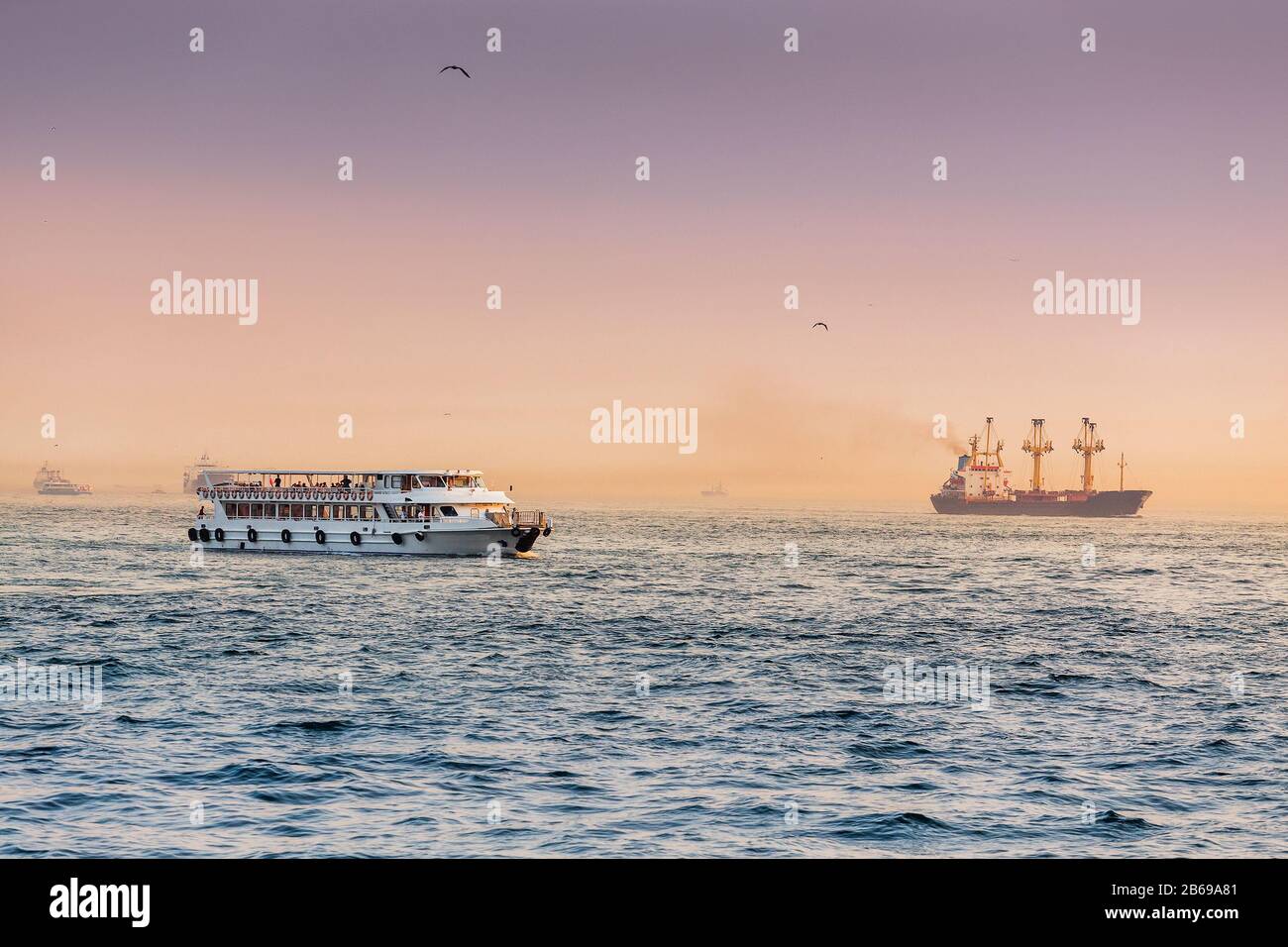 Ferry boat and Cargo Ship far away, sea and water transport concept ...