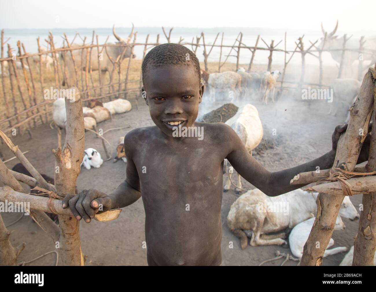 Smiling Mundari tribe boy in a cattle camp, Central Equatoria, Terekeka, South Sudan Stock Photo ...
