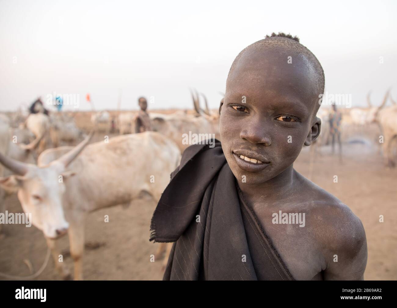 Smiling Mundari tribe boy in a cattle camp, Central Equatoria, Terekeka, South Sudan Stock Photo ...