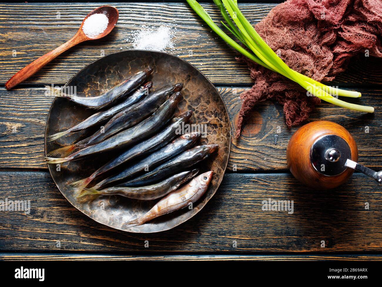 preparation of raw smelt fish, raw smelt fish on plate Stock Photo - Alamy