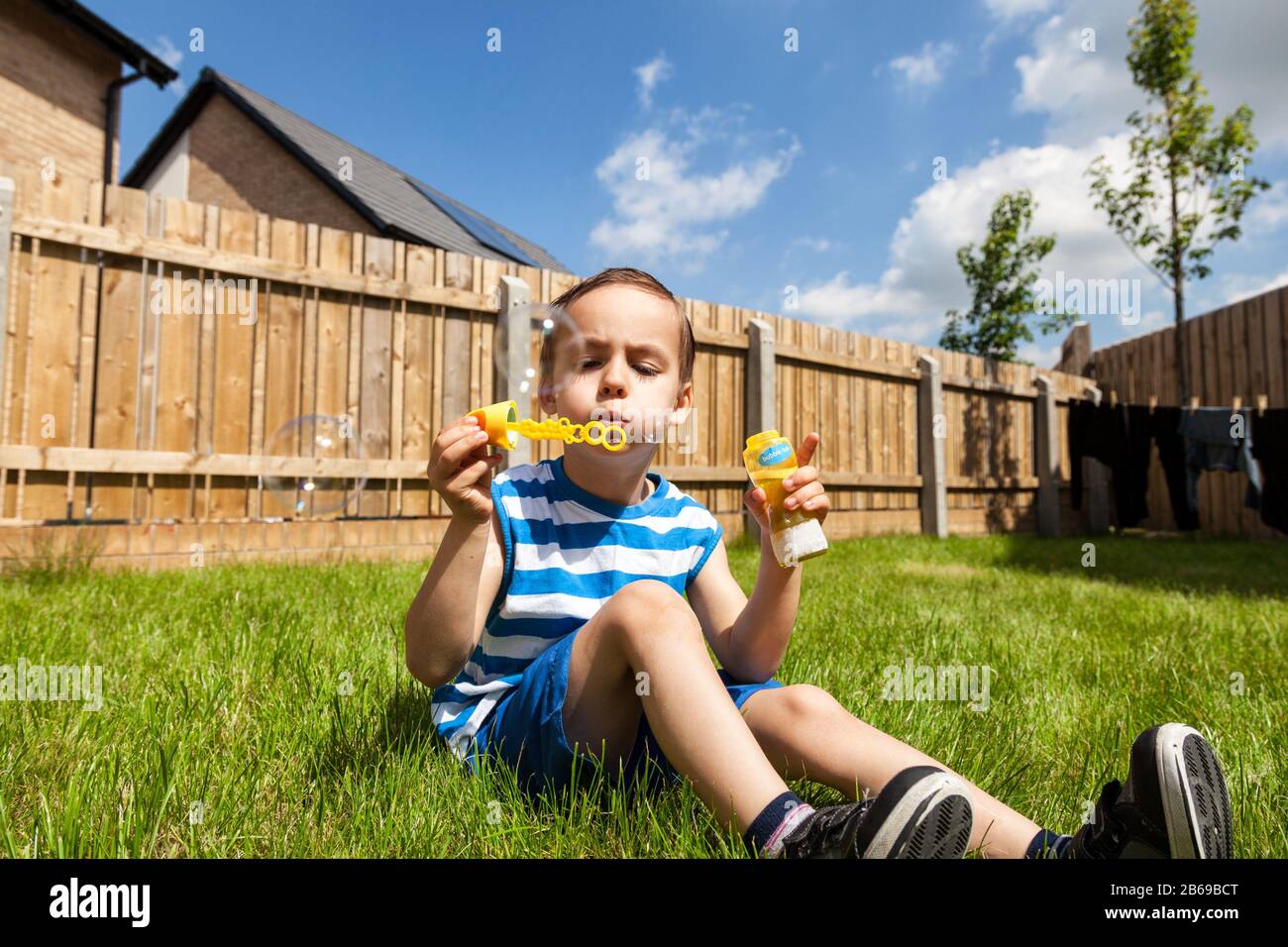 Boy blowing soap bubble Stock Photo - Alamy Boy blowing soap bubble Stock Photo - Alamy