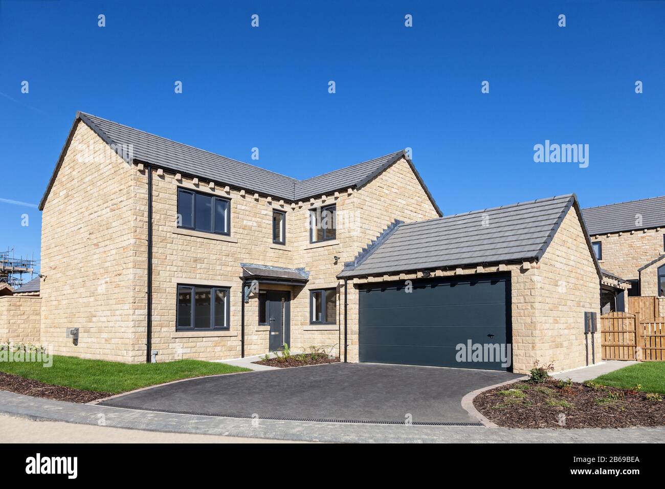 Elegant and wealthy english house with garage Stock Photo - Alamy
